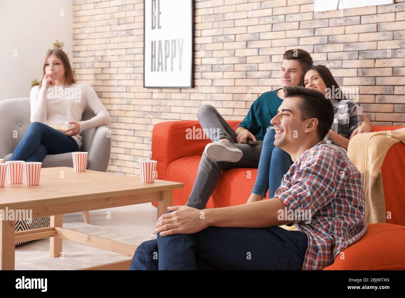 People Watching A Movie At Home