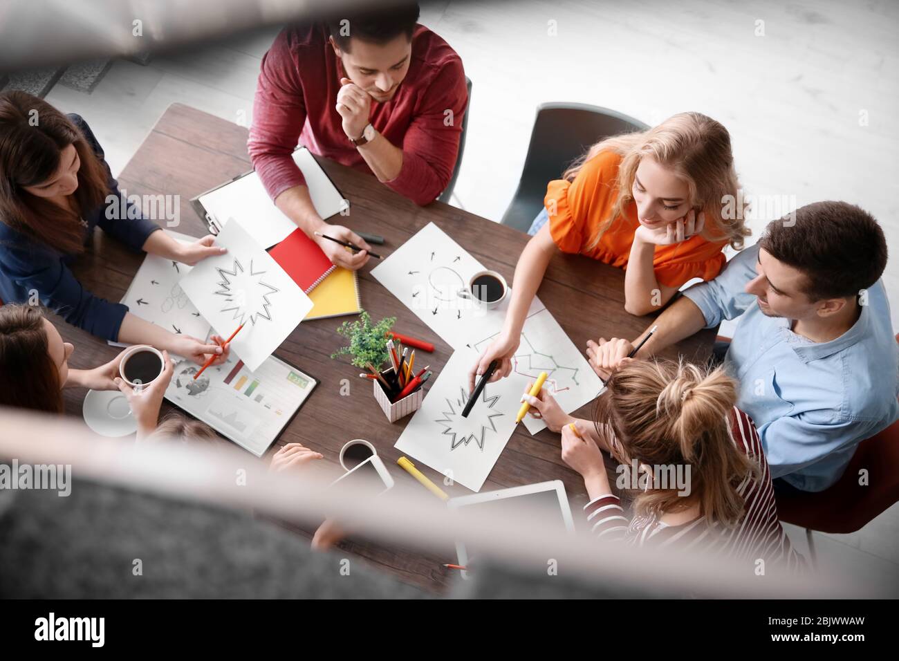 Young people working on project together indoors. Unity concept Stock ...