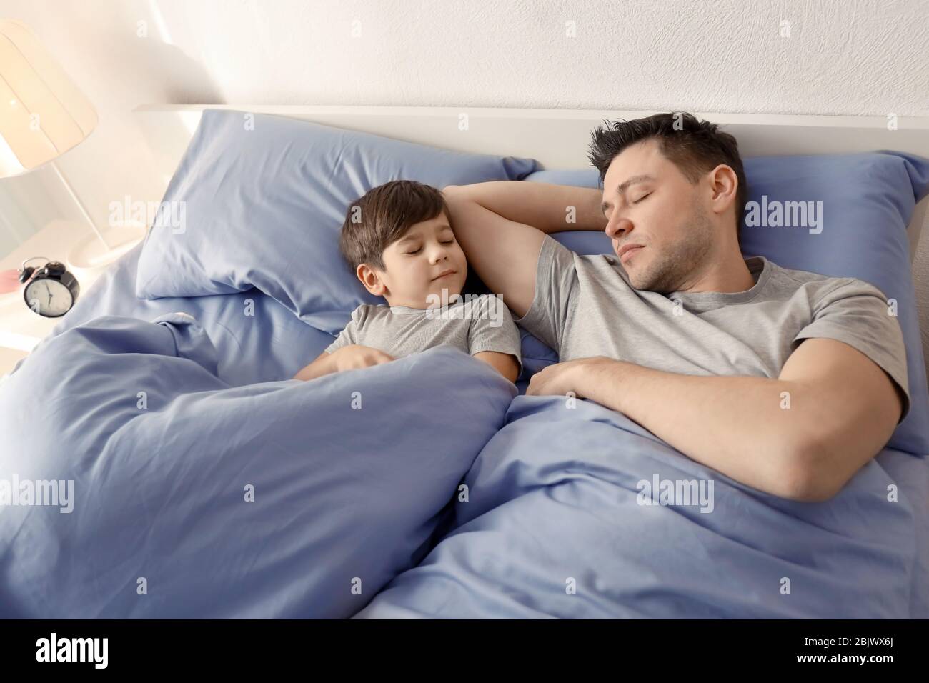 Father asleep in bed hi-res stock photography and images - Alamy