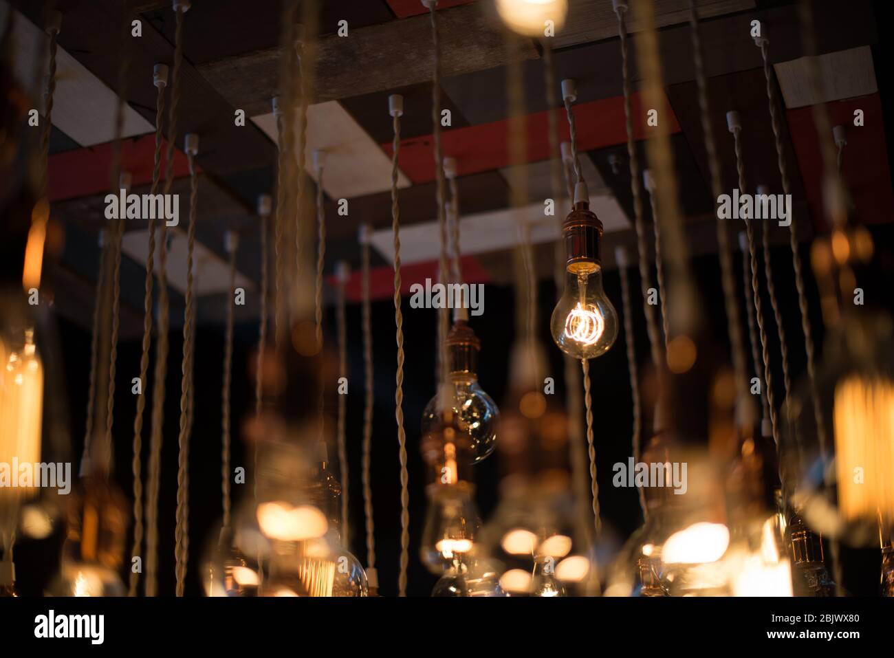 Hanging array of many incandescent light bulbs Stock Photo - Alamy