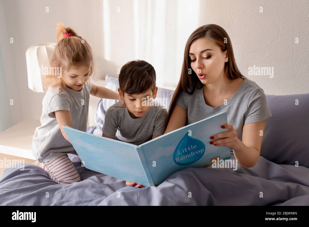 Woman Reading Bedtime Story Children High Resolution Stock Photography ...