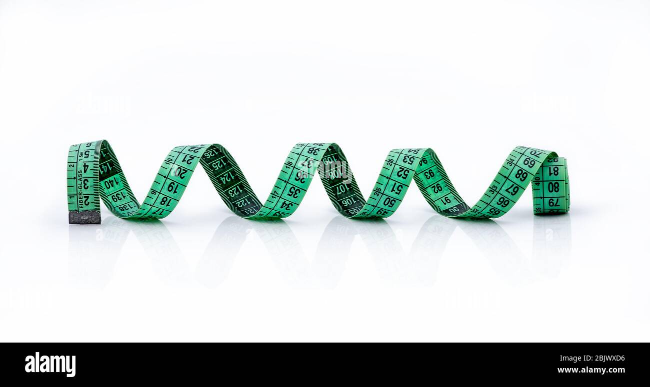 Green measuring tape of the tailor isolated on white background ...