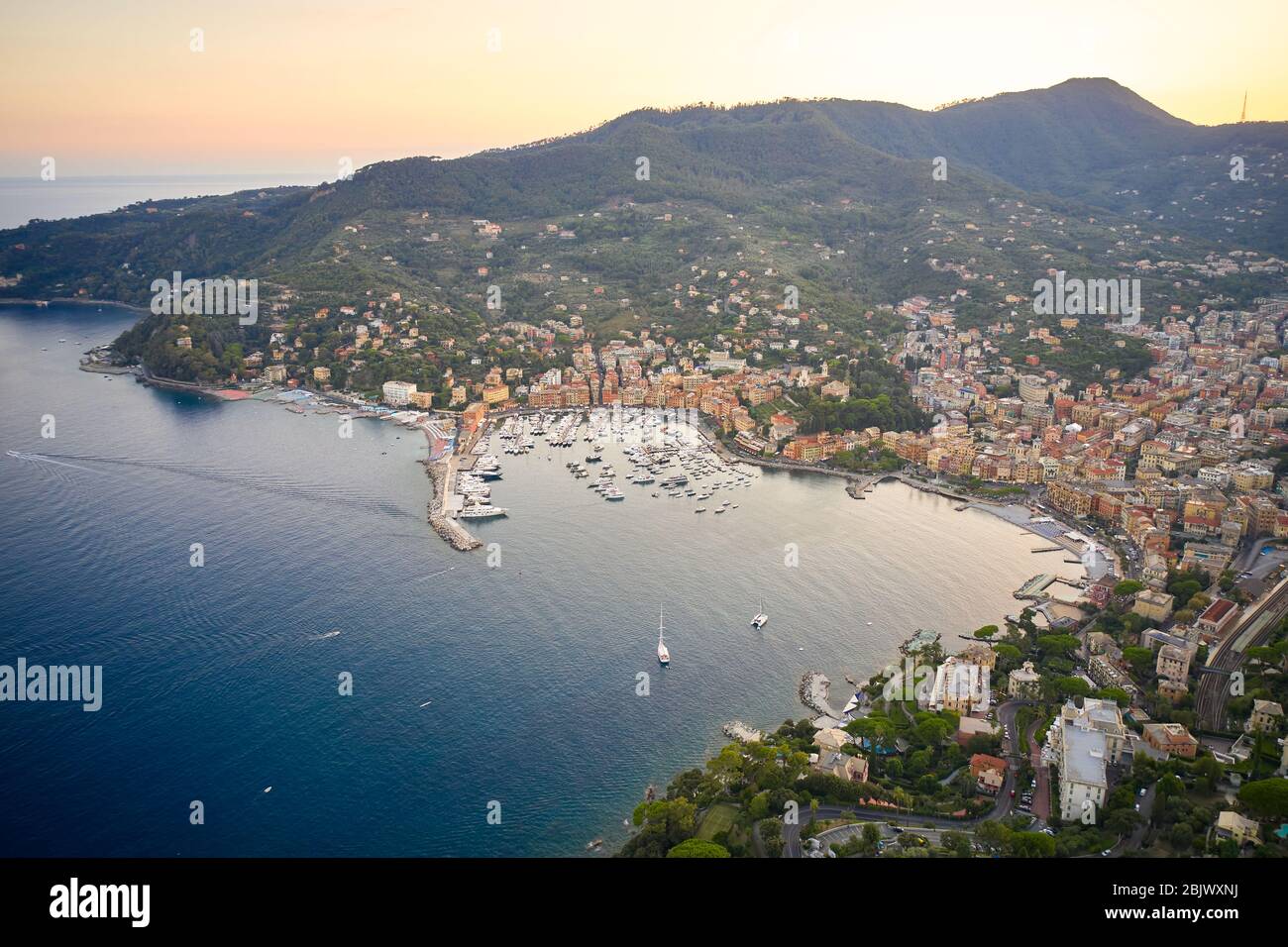Reflection of sun rays in the water Ligurian sea at the sunset ...