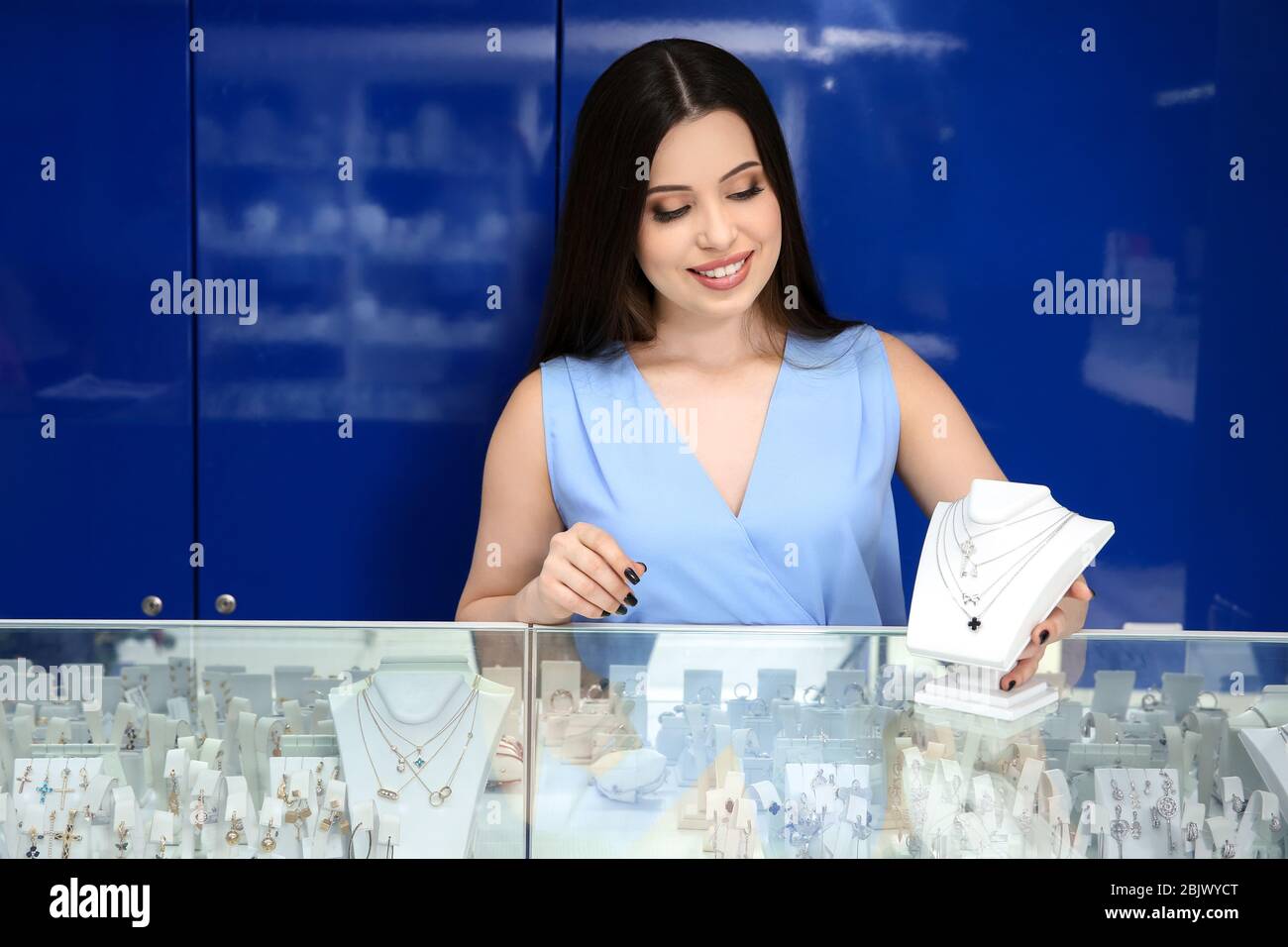 Female shop assistant counter fashion hi-res stock photography and ...