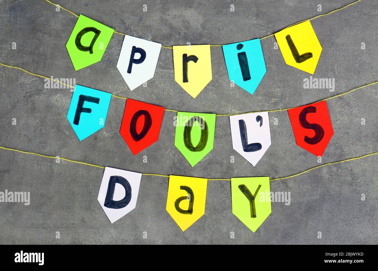 Colorful flags with phrase "April fool's day" on grey background Stock ...