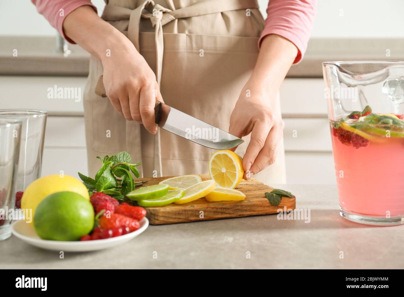 Woman preparing lemonade homemade summer hi-res stock photography and ...
