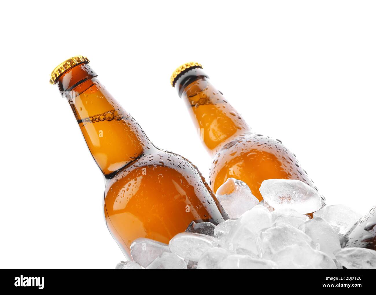 Bottles of beer in ice on white background Stock Photo - Alamy