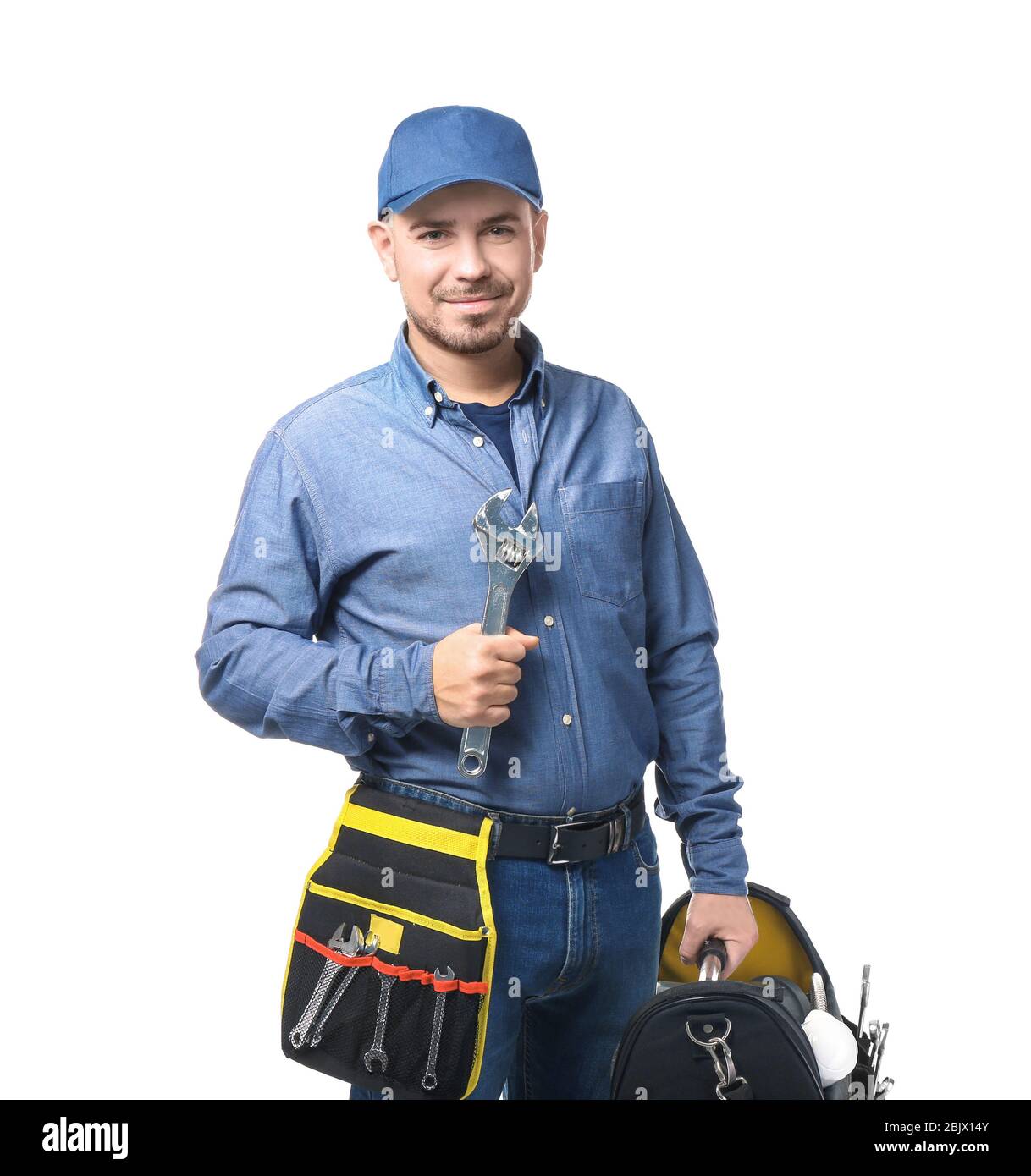 Plumber with set of tools on white background Stock Photo - Alamy