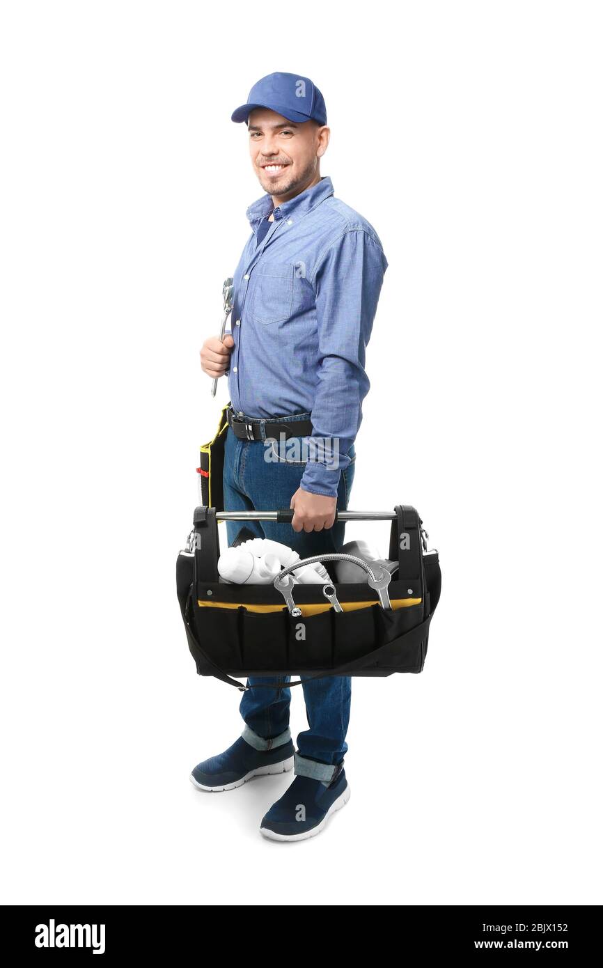 Plumber with tool bag and wrench on white background Stock Photo - Alamy