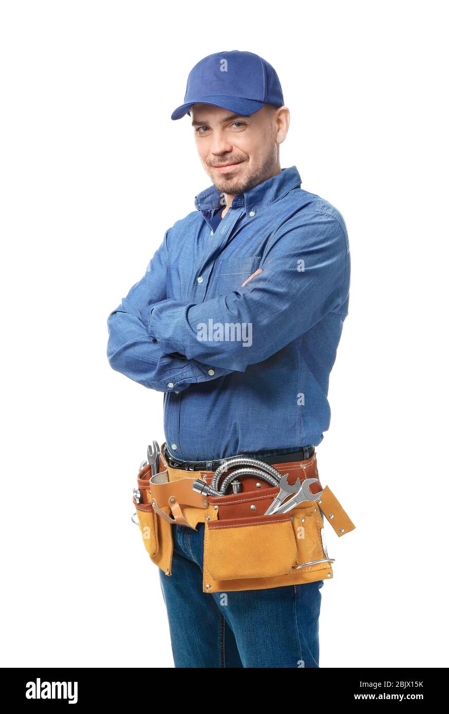 Plumber with tool belt on white background Stock Photo - Alamy