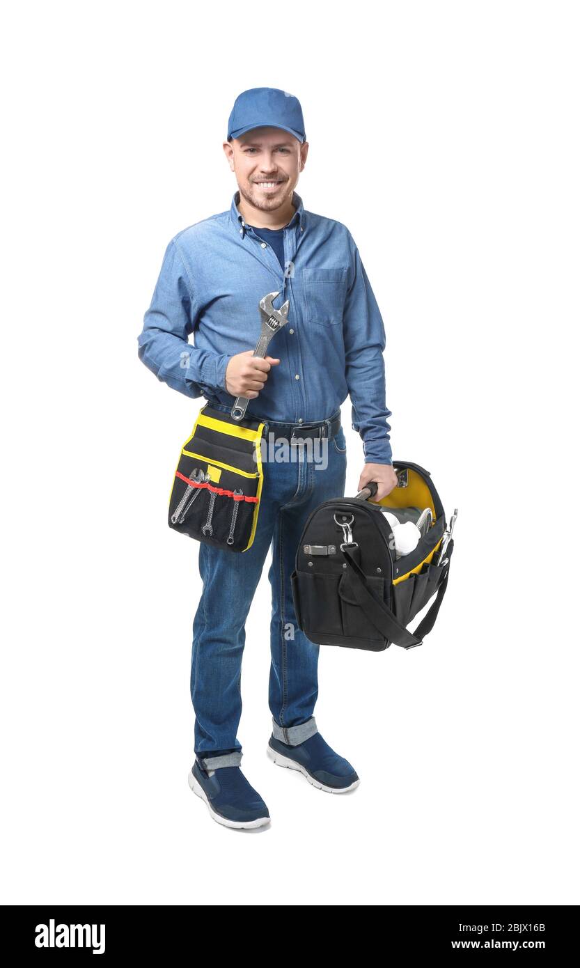 Plumber with set of tools on white background Stock Photo - Alamy