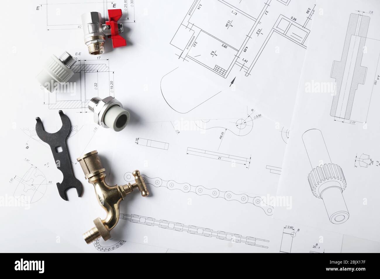 Plumber's items on drawing Stock Photo - Alamy