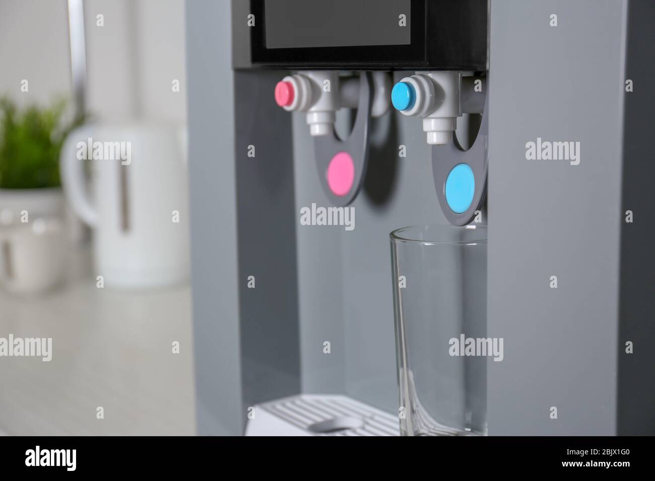 Office water cooler with glass, closeup Stock Photo - Alamy