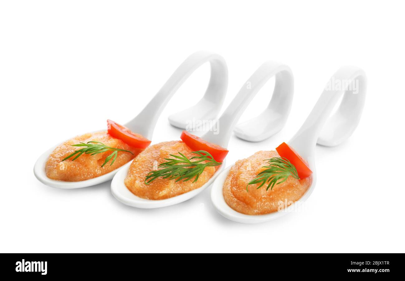 Delicious cod caviar in ceramic spoons on white background Stock Photo ...