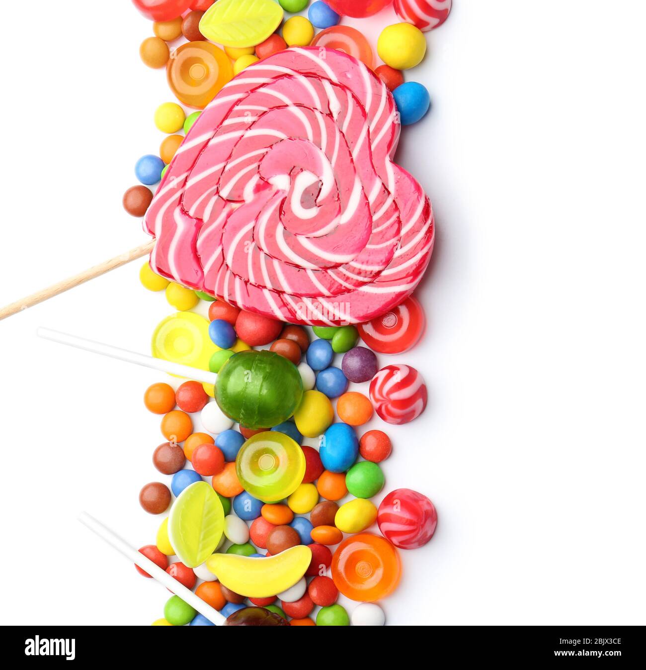 Different colorful candies on white background Stock Photo - Alamy