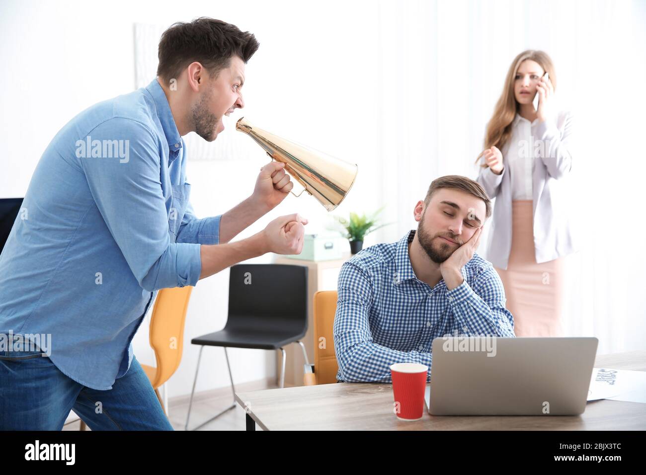 Angry boss with megaphone screaming at sleeping employee in office ...