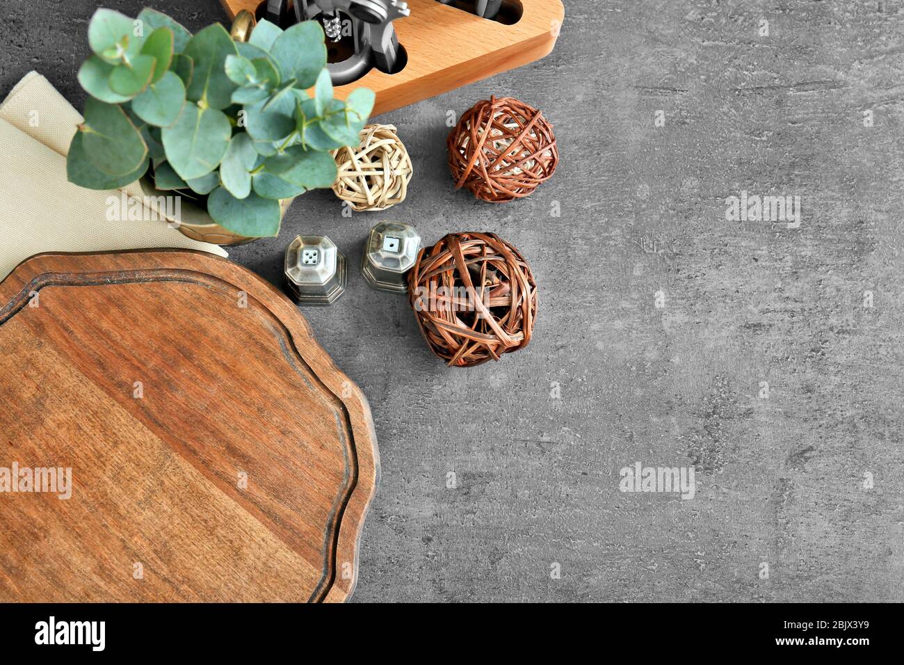 Composition with wooden board on grey background Stock Photo - Alamy