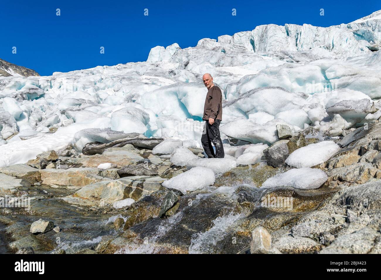 At the edge of the Matier Glacier, Joffre Lakes Provincial Park ...