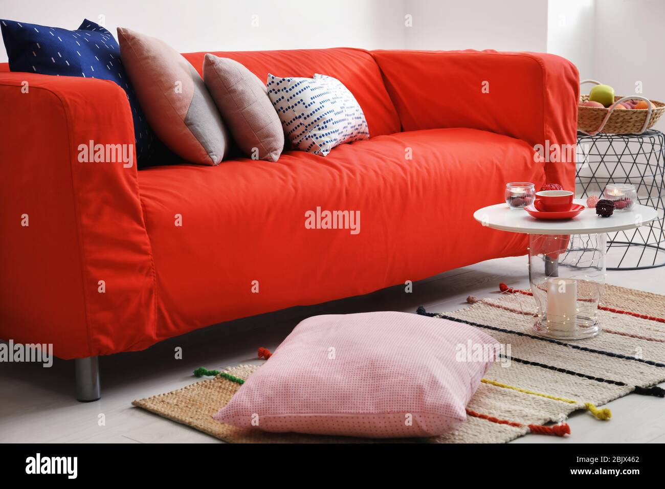 Living room interior with comfortable red sofa Stock Photo - Alamy