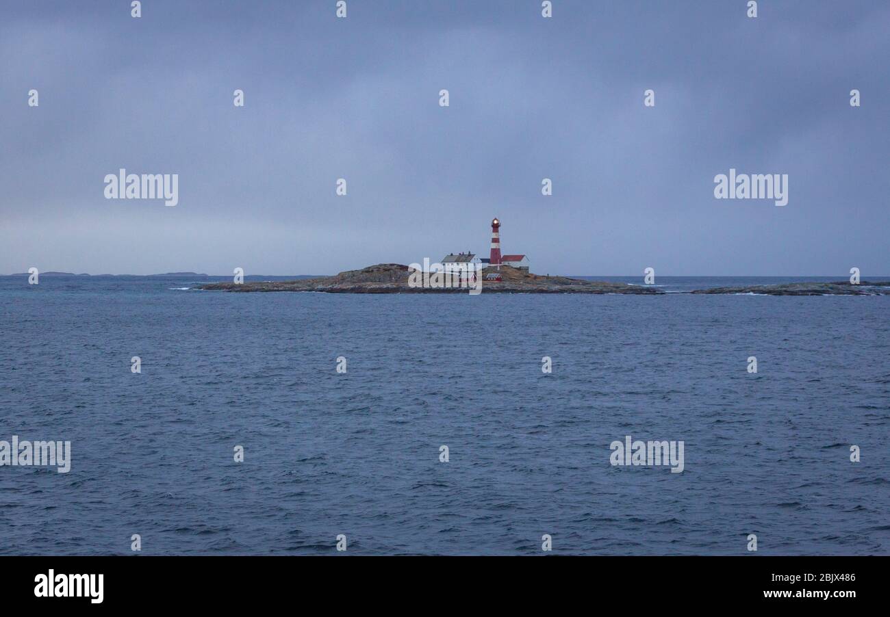 Cruise along the Norwegian coast and the red lighthouse Landegode Fyr ...