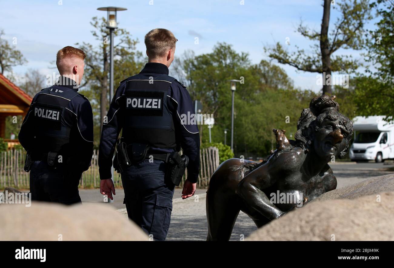 Thale, Germany. 30th Apr, 2020. Police officers patrol the witches ...