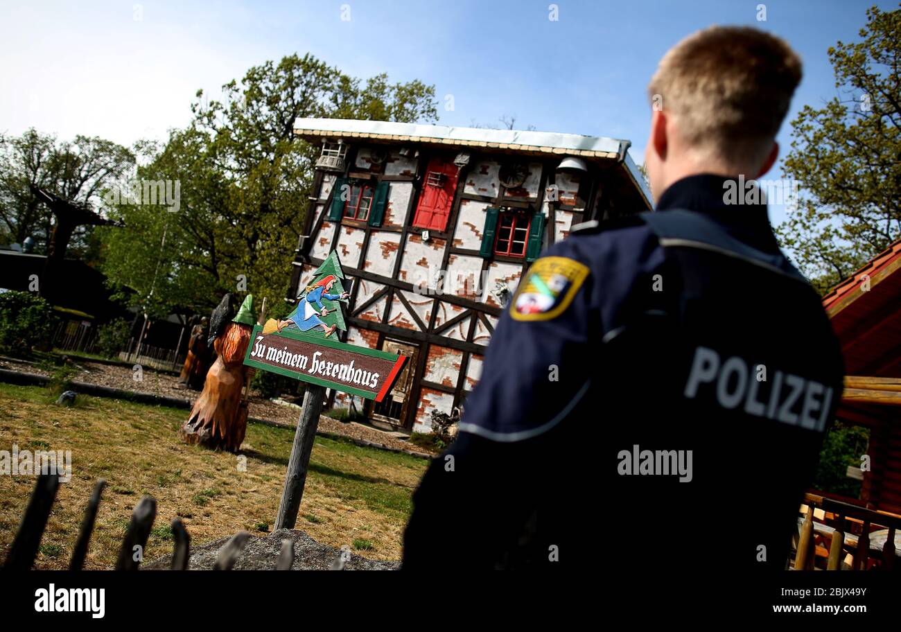 Thale, Germany. 30th Apr, 2020. A police officer patrols the witches ...