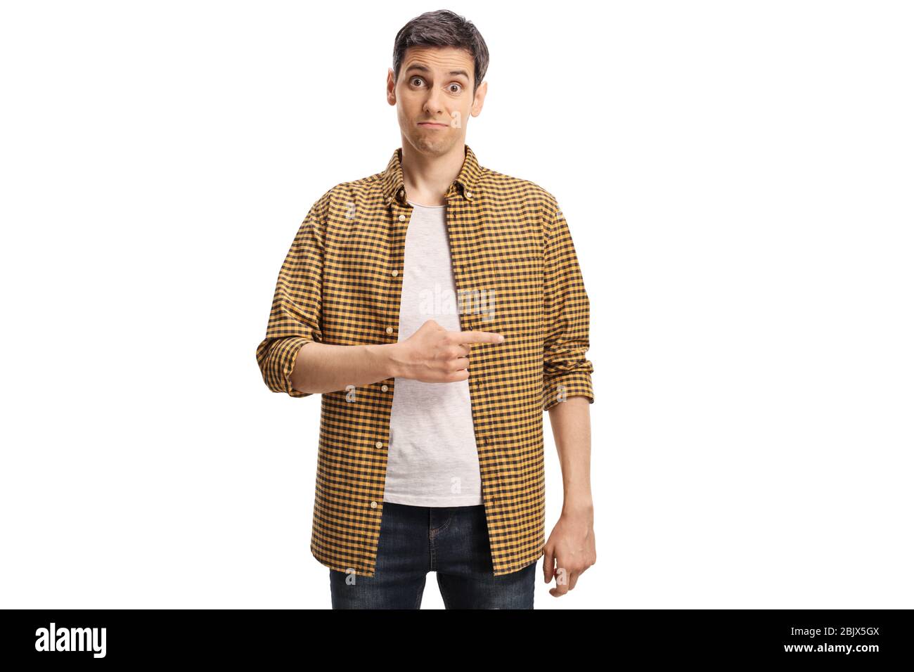 Disappointed young man pointing isolated on white background Stock ...