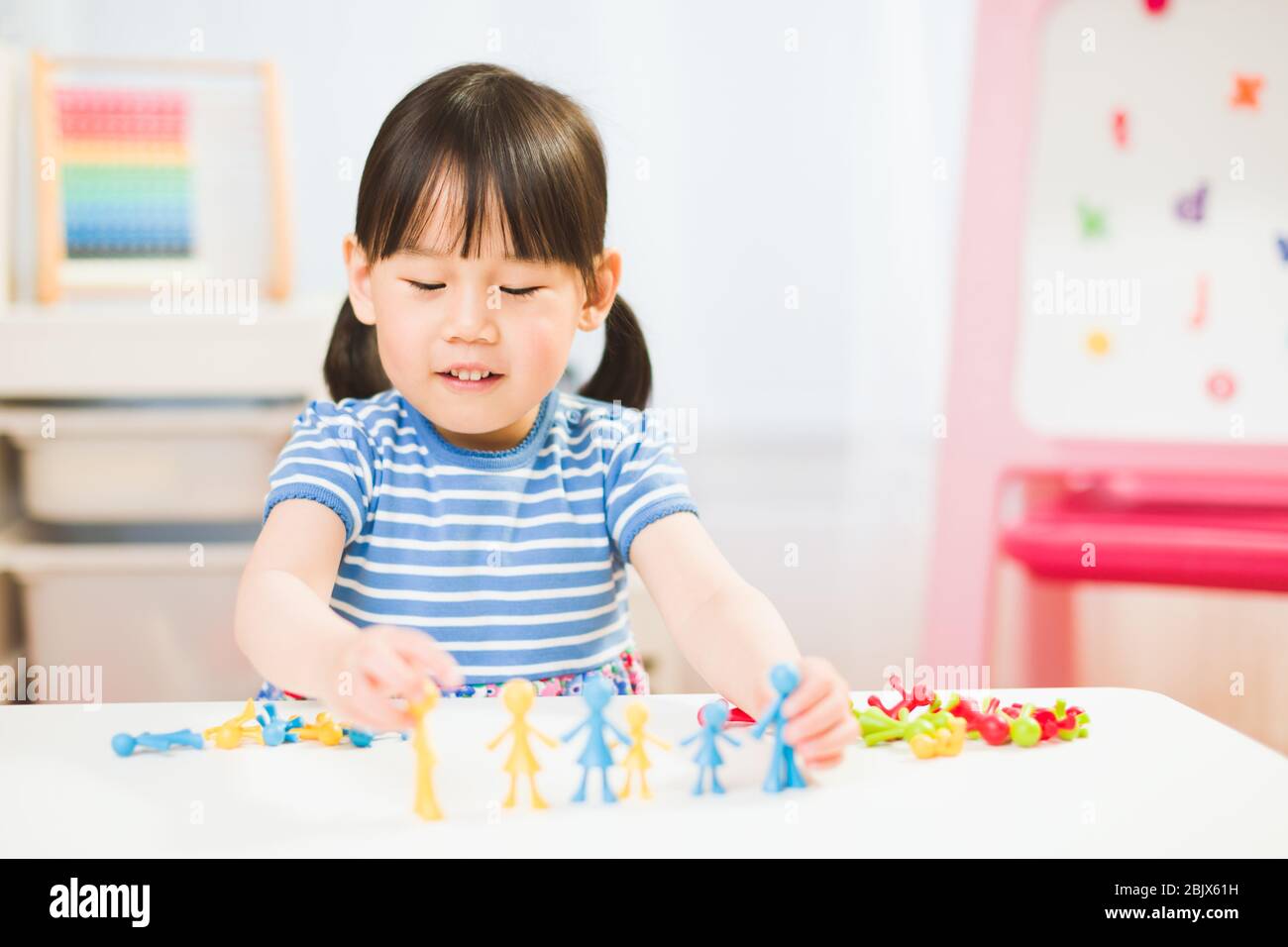 toddler girl learning counting and math for homeschooling Stock Photo ...