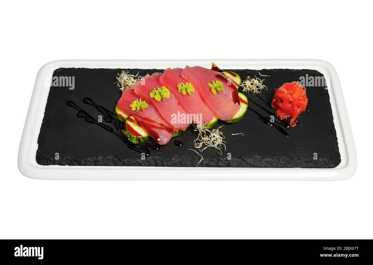 Slate plate with delicious tuna sashimi on white background Stock Photo ...