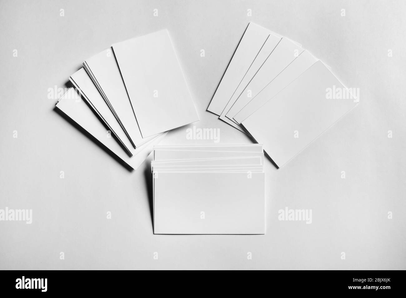 Blank business cards on white background Stock Photo - Alamy