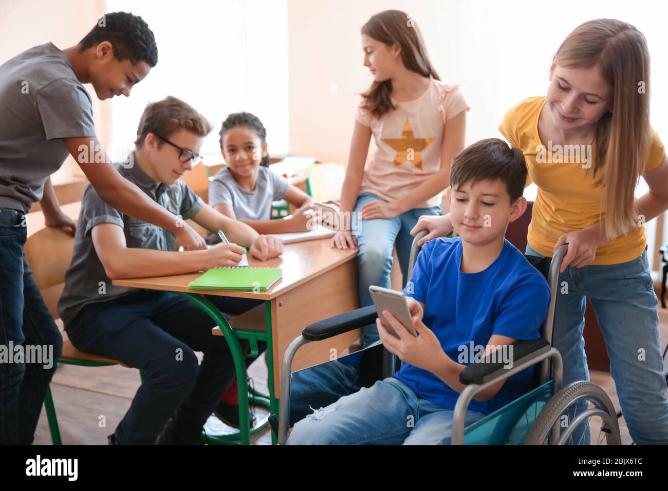 School friend wheelchair hi-res stock photography and images - Alamy