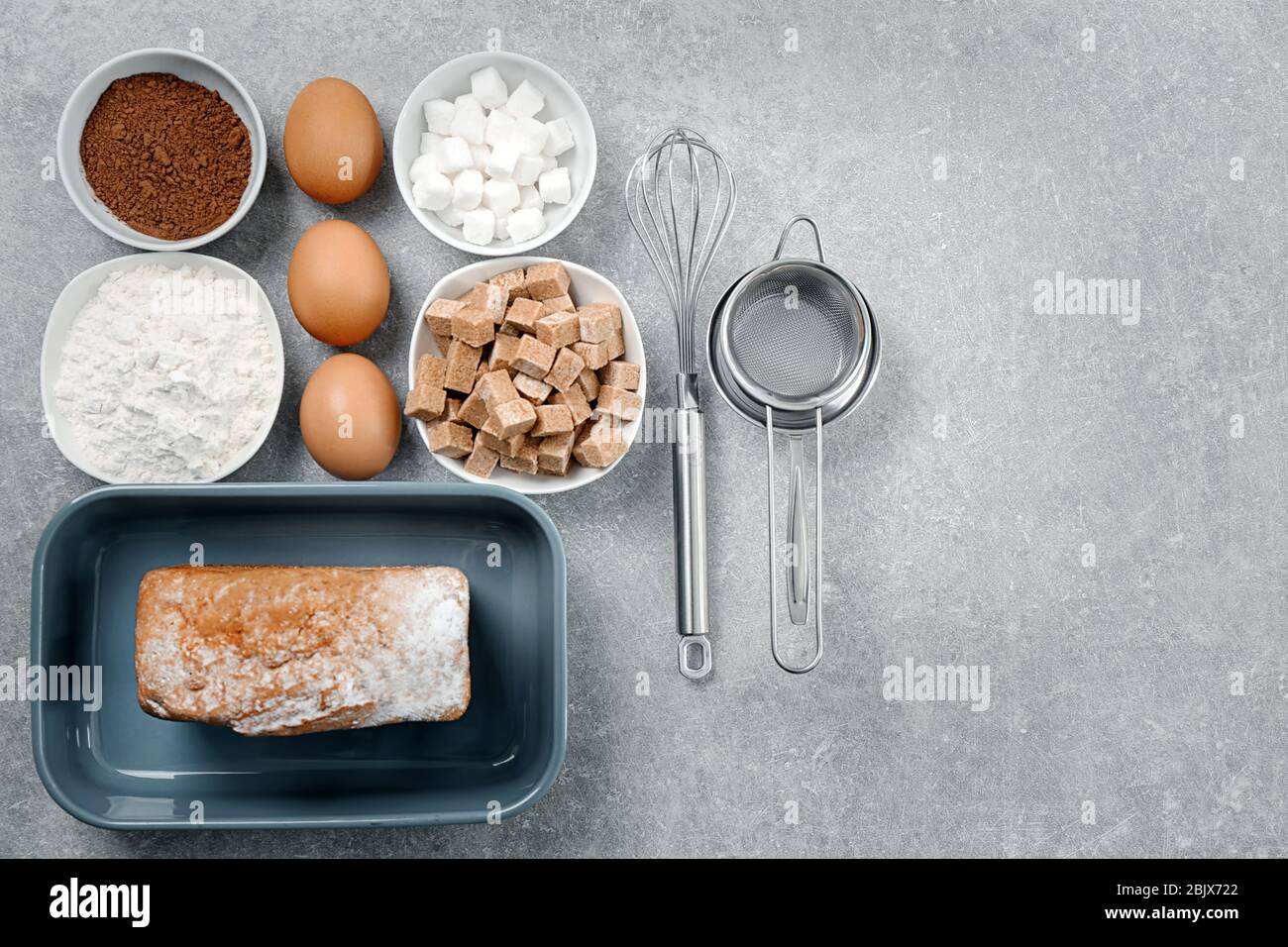 Kitchen utensils and products on grey background. Cooking master ...