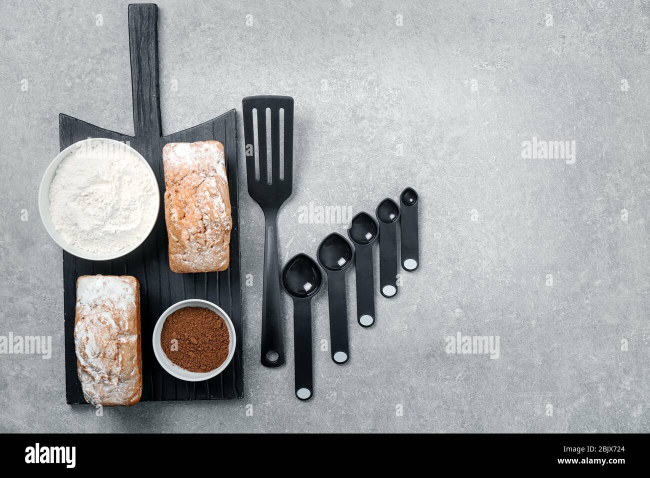 Kitchen utensils and products on grey background. Cooking master ...