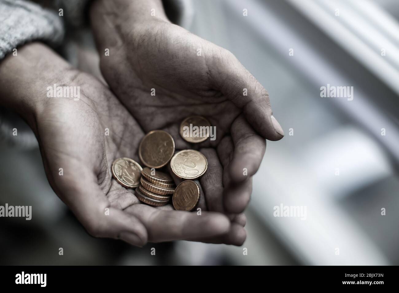 Dirty hand holding coins hi-res stock photography and images - Alamy