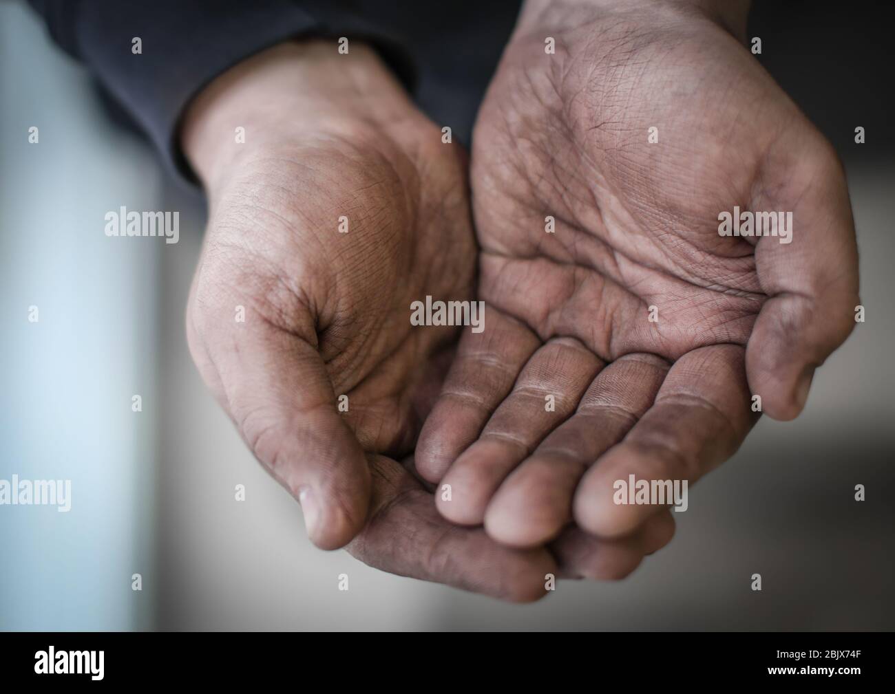 Poor man begging for money, closeup Stock Photo - Alamy