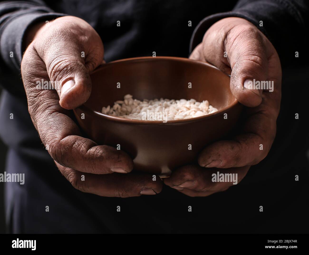 Holding bowl of rice hi-res stock photography and images - Alamy