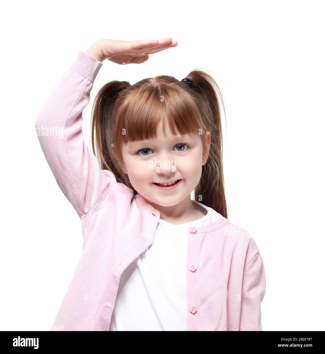Little girl measuring height on white background Stock Photo - Alamy