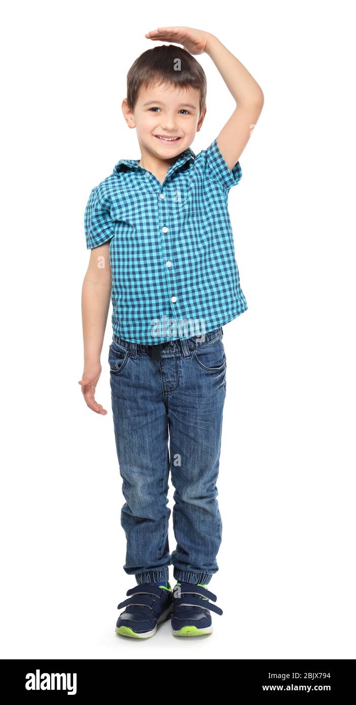 Little boy measuring height on white background Stock Photo - Alamy