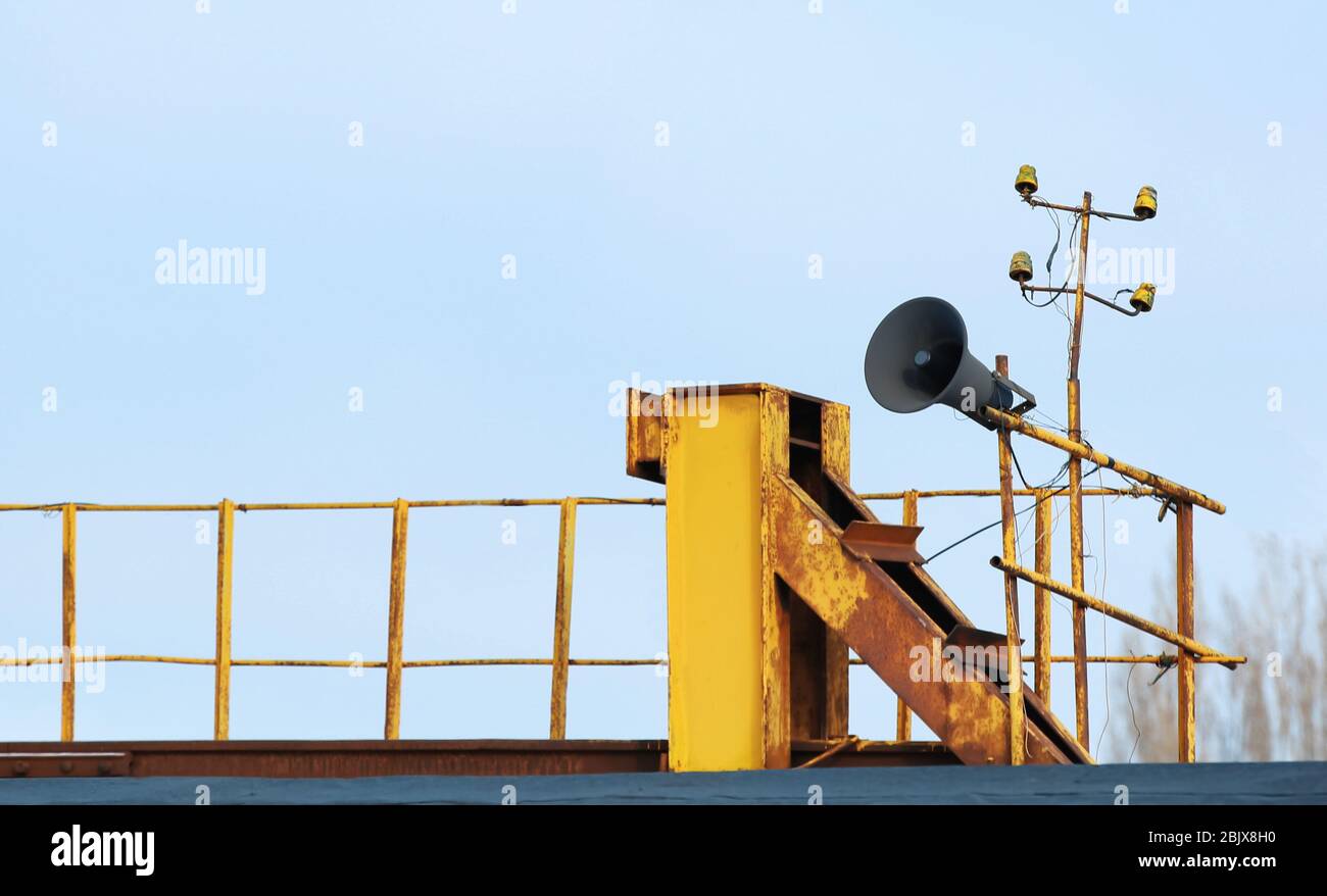 Megaphone on metal construction outdoors Stock Photo - Alamy