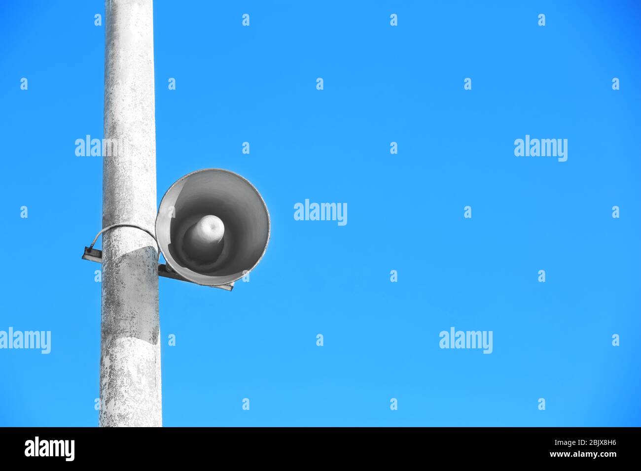 Megaphone on pole outdoors Stock Photo - Alamy