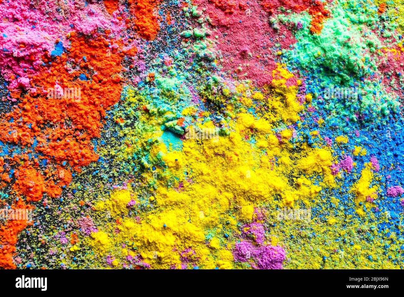 Colorful powders for Holi festival as background Stock Photo - Alamy