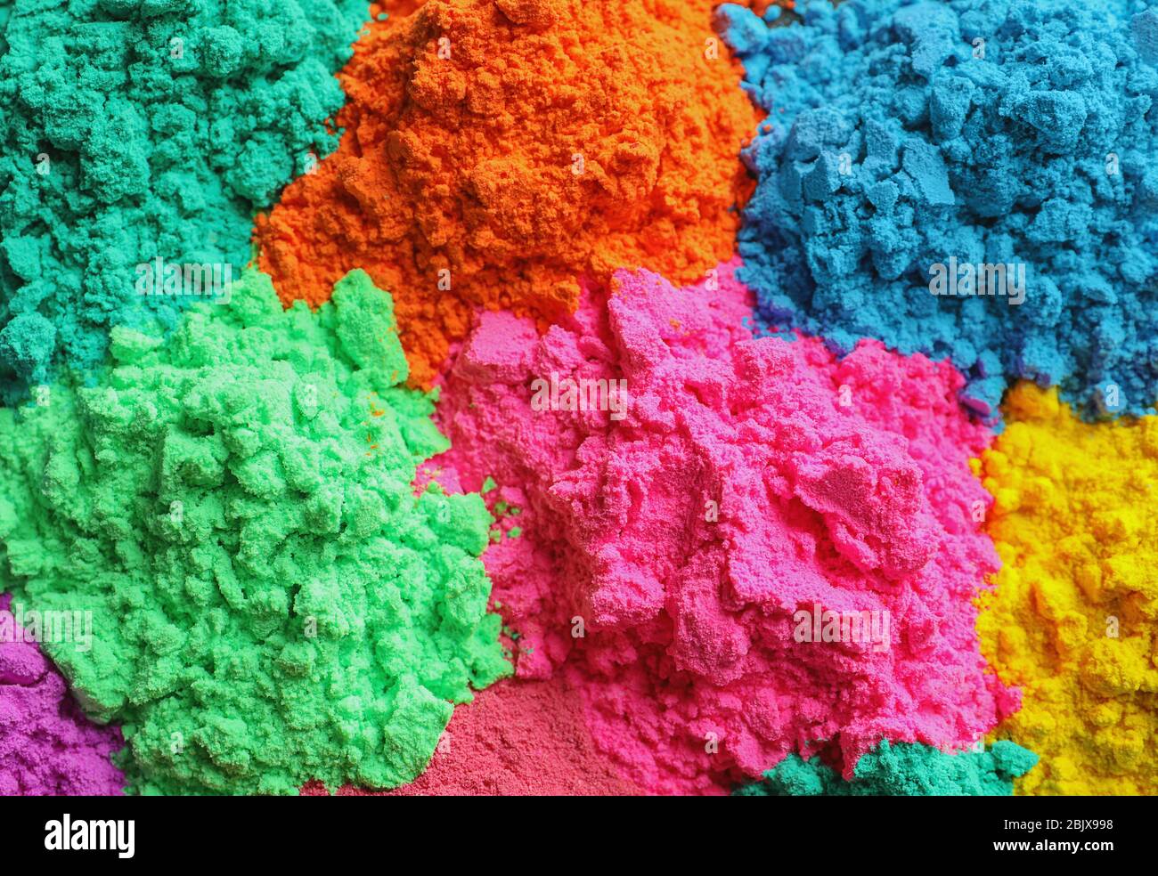 Colorful powders for Holi festival as background Stock Photo - Alamy