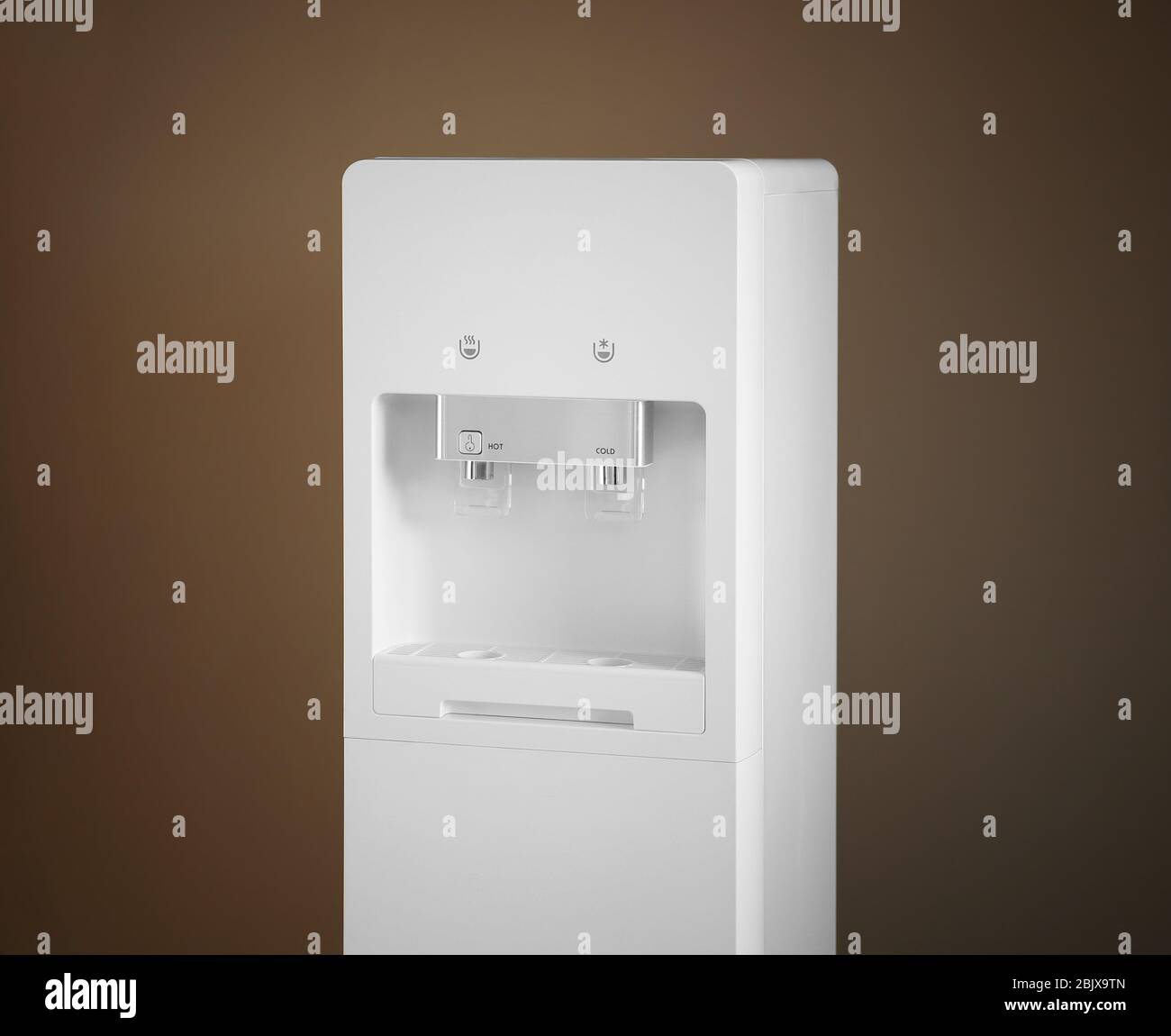 Modern water cooler on color background Stock Photo - Alamy