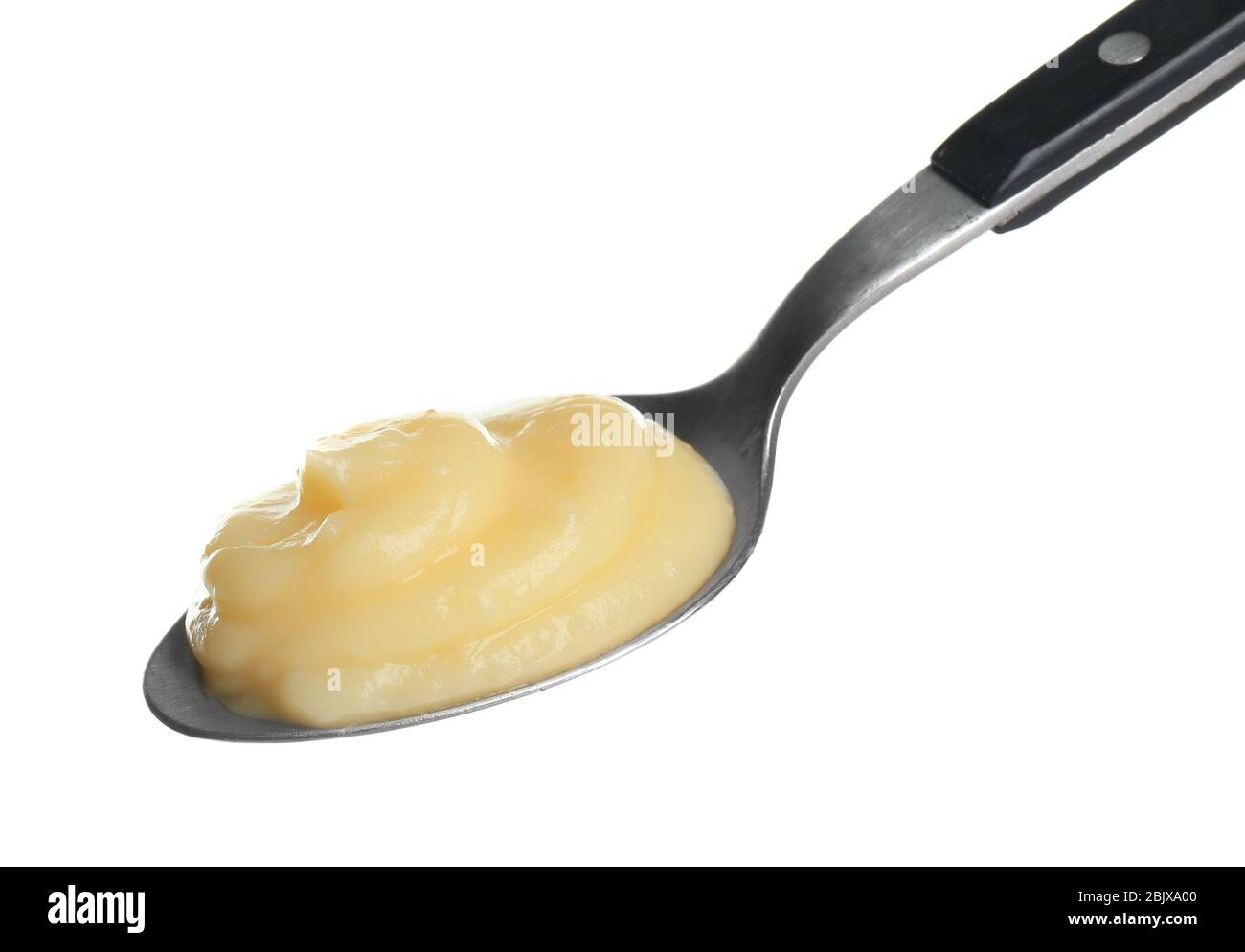 Tasty vanilla pudding in spoon on white background Stock Photo - Alamy