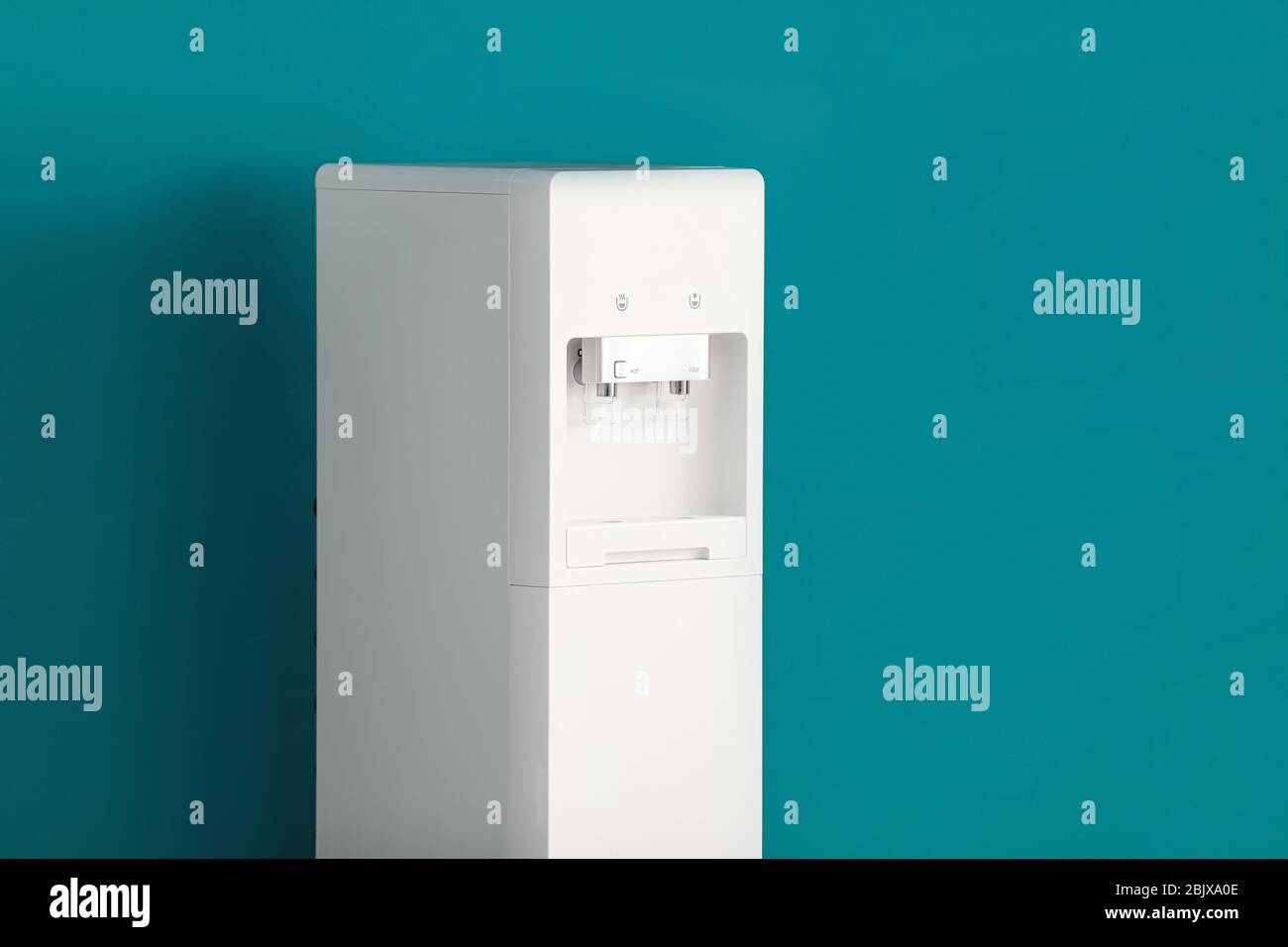 Modern water cooler near color background Stock Photo - Alamy