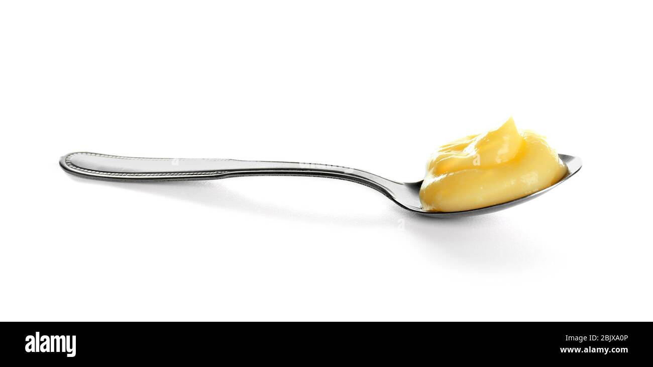Tasty vanilla pudding in spoon on white background Stock Photo - Alamy