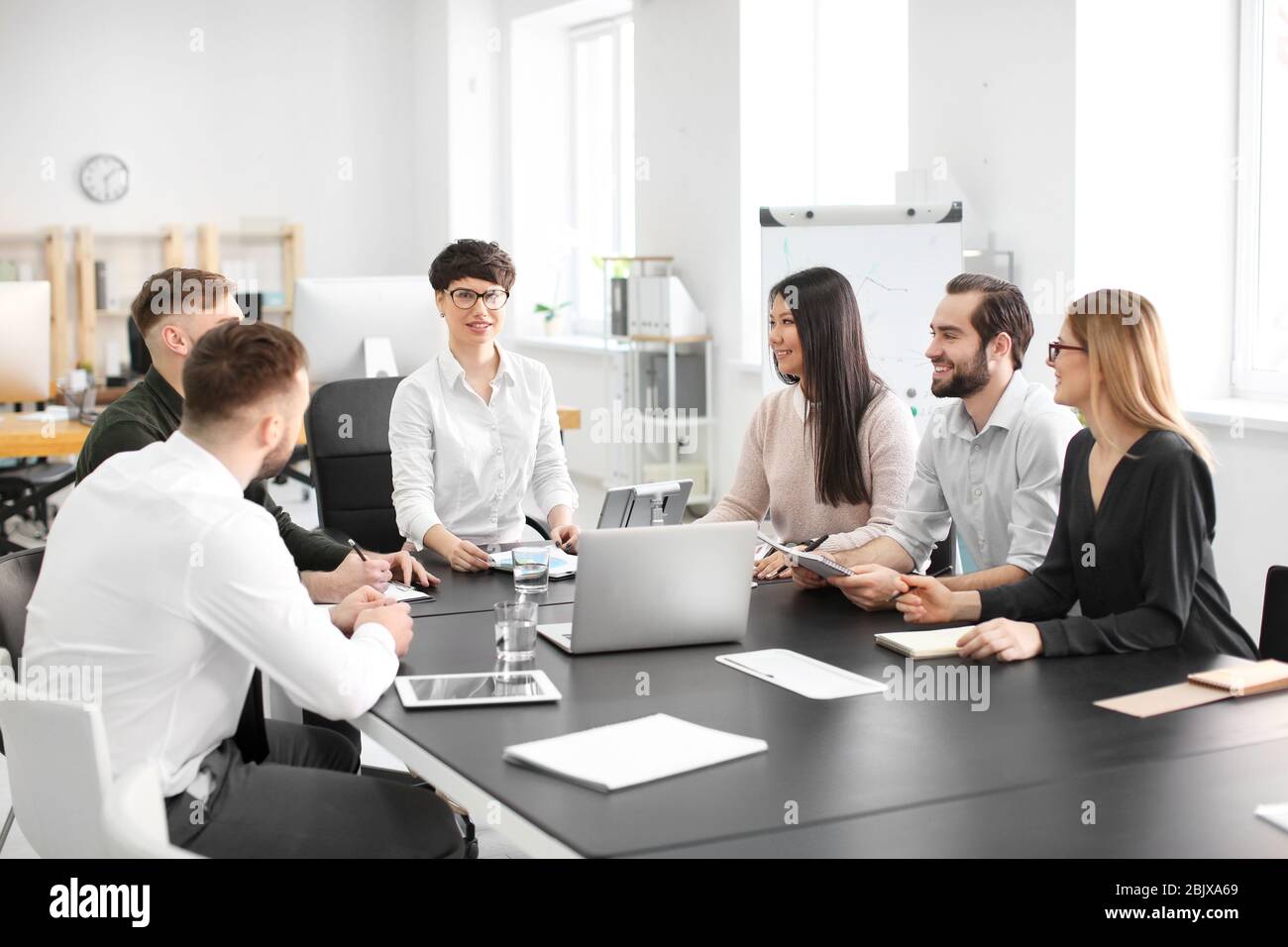 Office employees having meeting in conference room. Finance trading ...