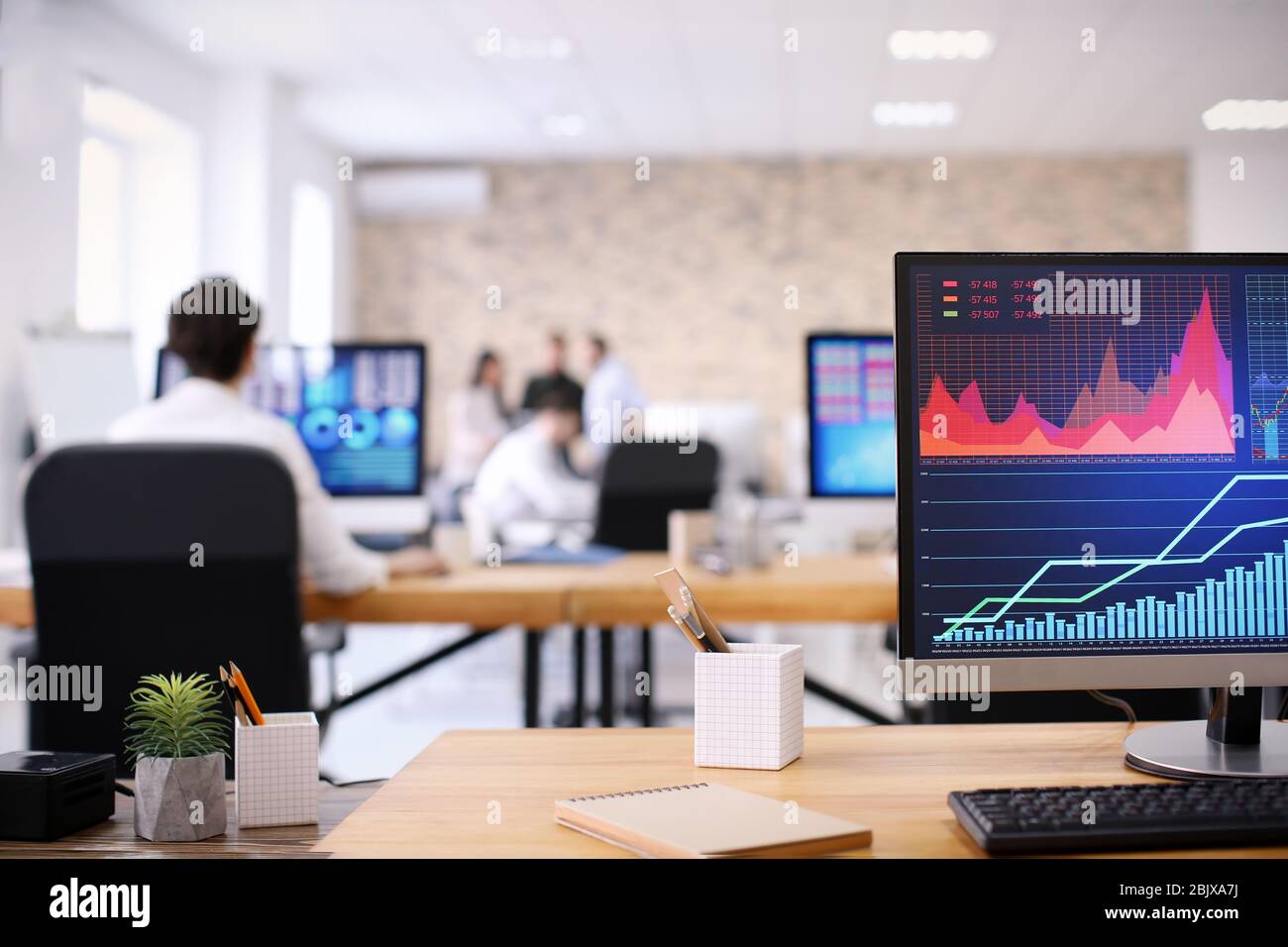 Computer screen with stock data in office. Finance trading Stock Photo ...