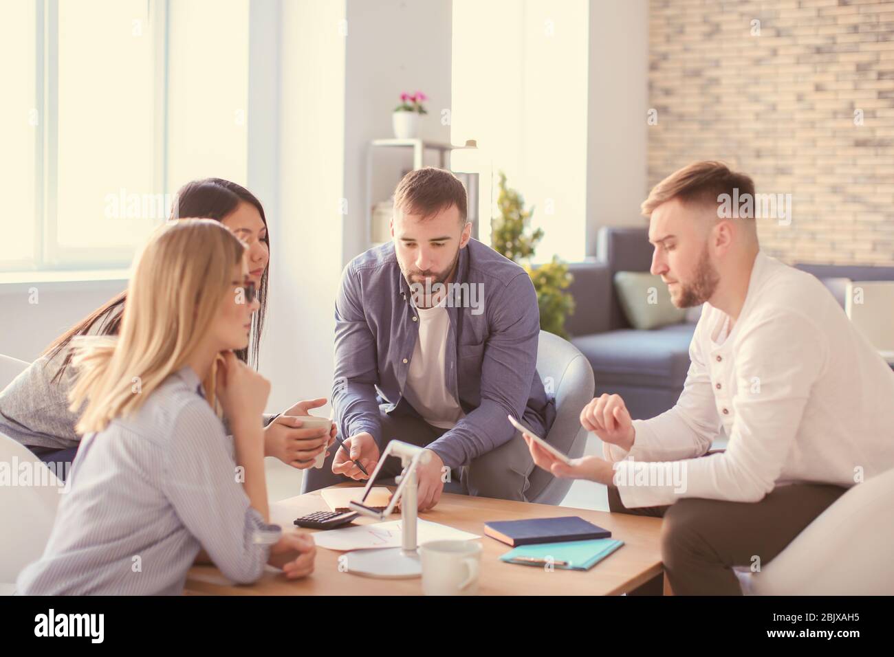 Office employees having meeting at workplace. Finance trading Stock ...