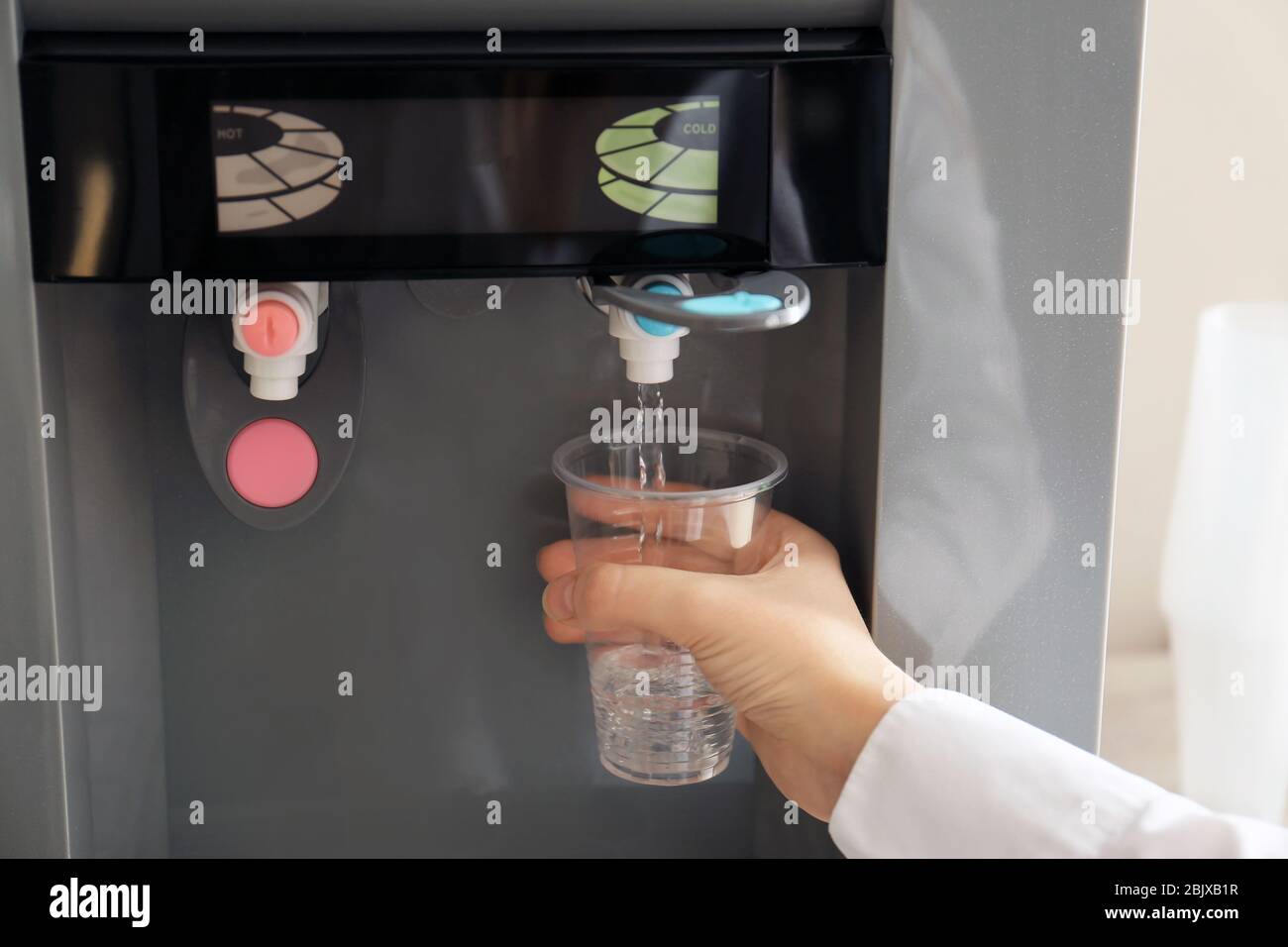 Person filling cup hot water hi-res stock photography and images - Alamy
